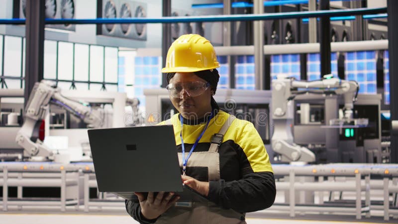 Smart Factory Engineer Using Laptop To Implement Automated Workflows