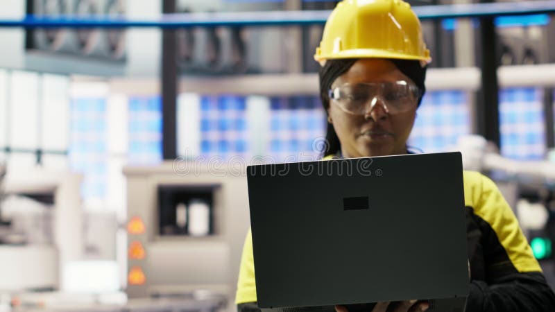Smart Factory Engineer Using Laptop To Implement Automated Workflows