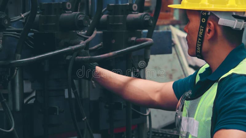 Smart Factory Worker Using Machine in Factory Workshop Stock Footage ...