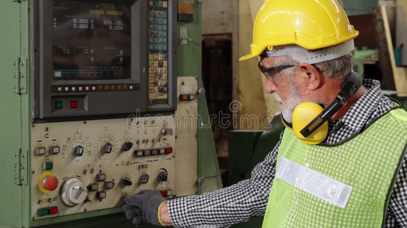 Group of Factory Workers Using Machine Equipment in Factory Workshop ...