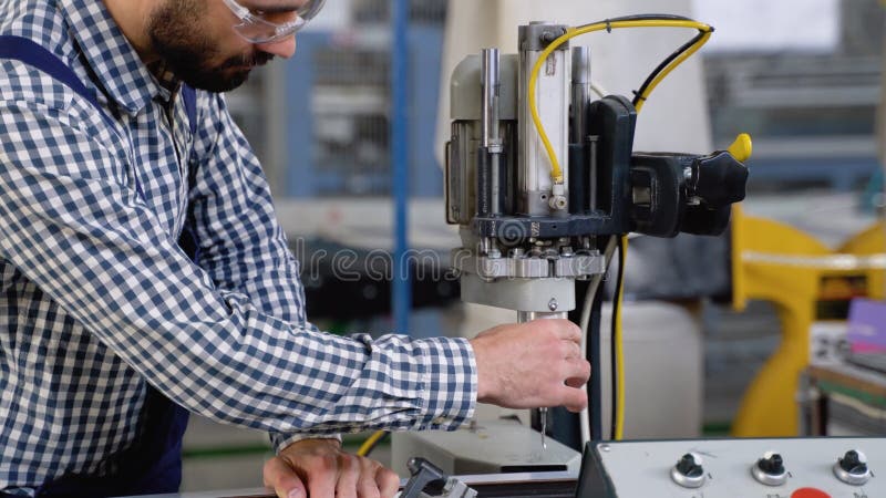 Smart Factory Worker Using Machine in Factory Workshop. Industry and ...