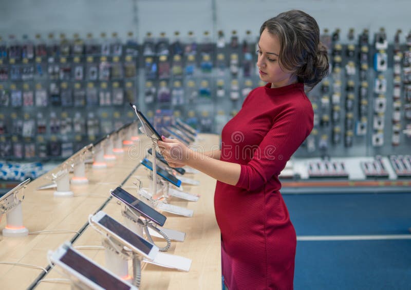 Female Customer Buying Spray Paint Can in the Supermarket. Stock Image ...
