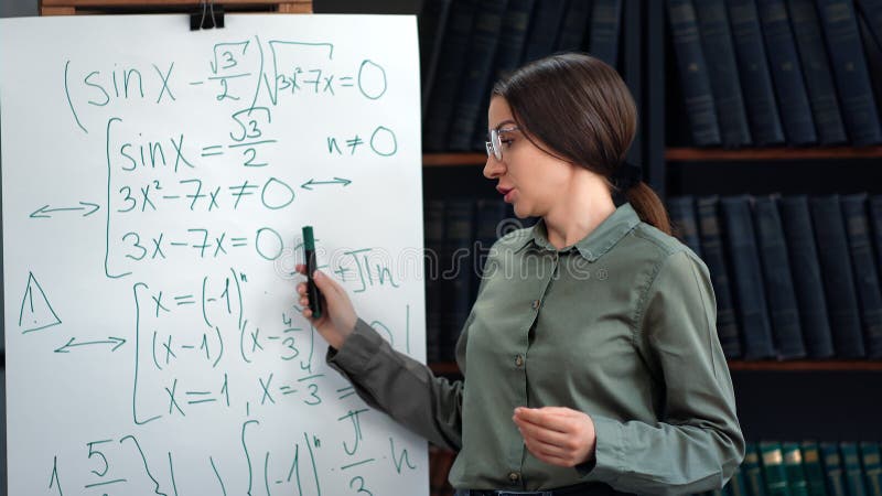 Smart Female Teacher Explaining Mathematics Formula Pointing Whiteboard ...