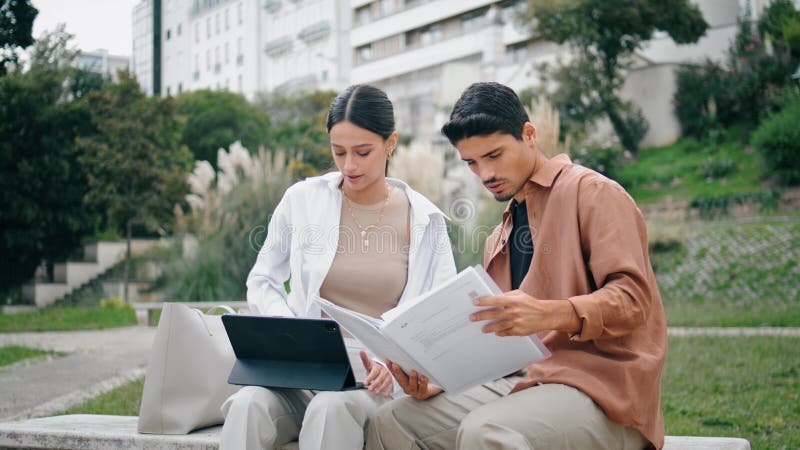 Smart Friends Studying Tablet on Park Bench. College Students Checking ...