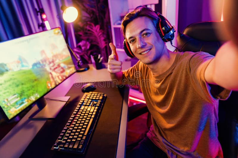 Smart Gaming Streamer Looking at Camera with Playing Battle Team ...