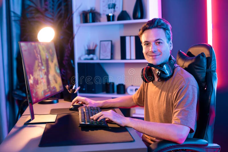 Smart Gaming Streamer Looking Camera while Playing the Fighting Moba ...