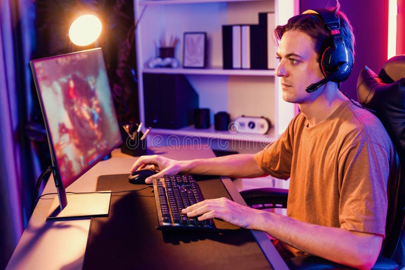 Smart Gaming Streamer Playing the Fighting Moba on Computer Screen ...