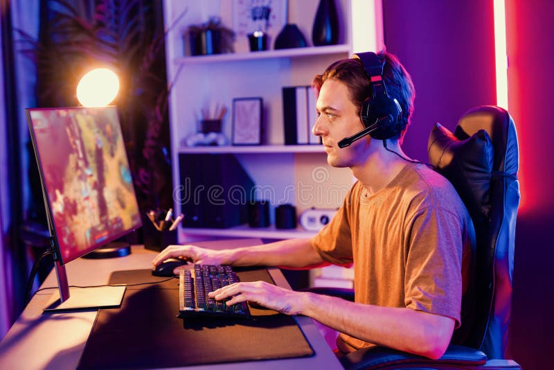 Smart Gaming Streamer Playing the Fighting Moba on Computer Screen ...