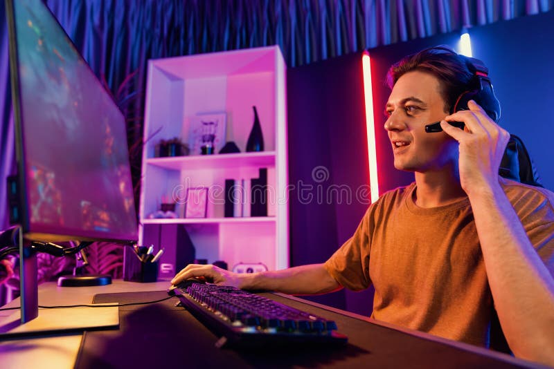 Smart Gaming Streamer Playing the Fighting Moba on Computer Screen ...