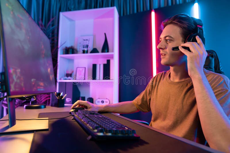 Smart Gaming Streamer Playing the Fighting Moba on Computer Screen ...