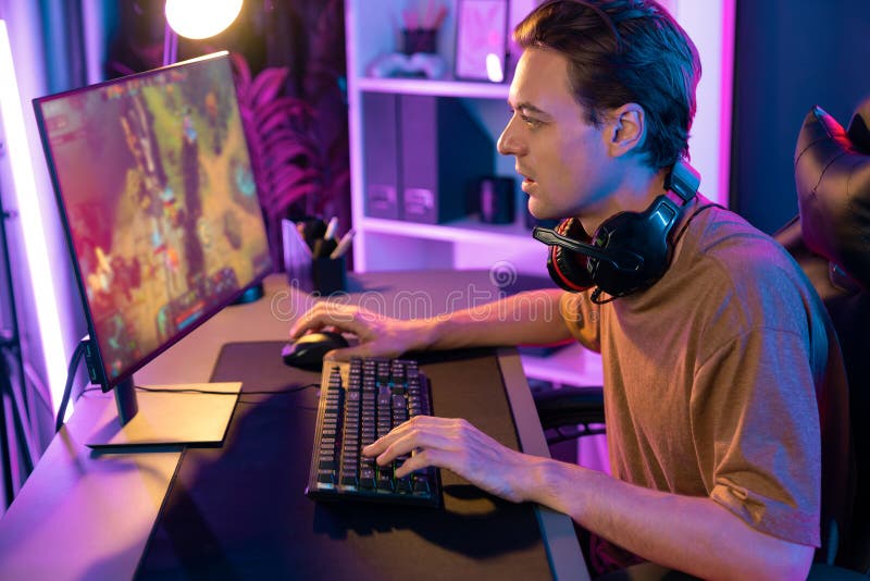 Smart Gaming Streamer Playing the Fighting Moba on Computer Screen ...