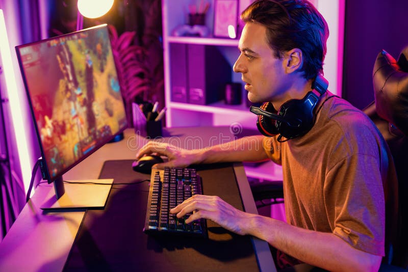 Smart Gaming Streamer Playing the Fighting Moba on Computer Screen ...