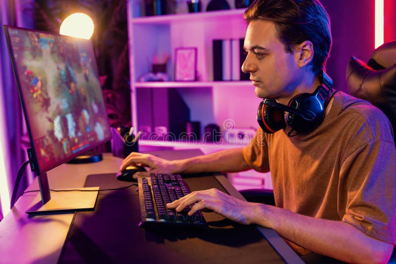 Smart Gaming Streamer Playing the Fighting Moba on Computer Screen ...