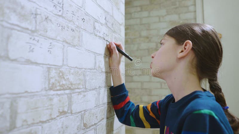 Smart Girl Solving Maths Equations on Wall Stock Video - Video of ... Smart Girl Solving Maths Equations on Wall Stock Video - Video of ...