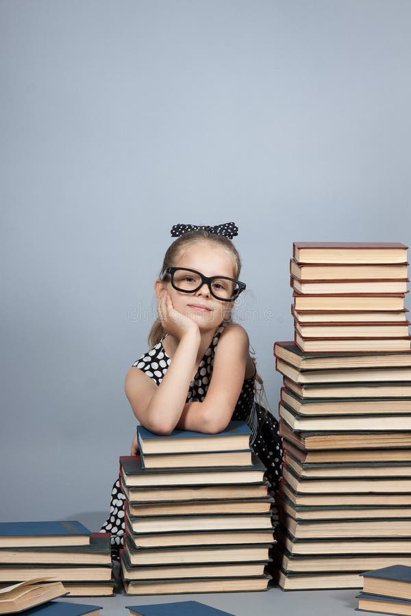 Smart Girl with a Stack of Books. Stock Photo - Image of reading ...