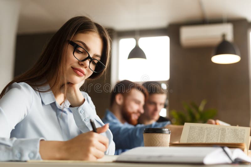 Smart Girl Student Studying at Library, Writing Essay Stock Photo ...
