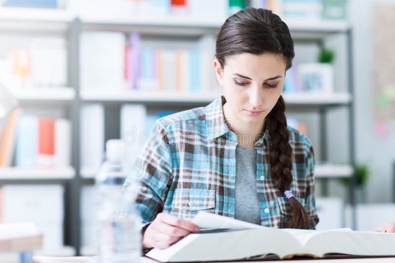 Smart girl reading a book stock photo. Image of student - 72628986