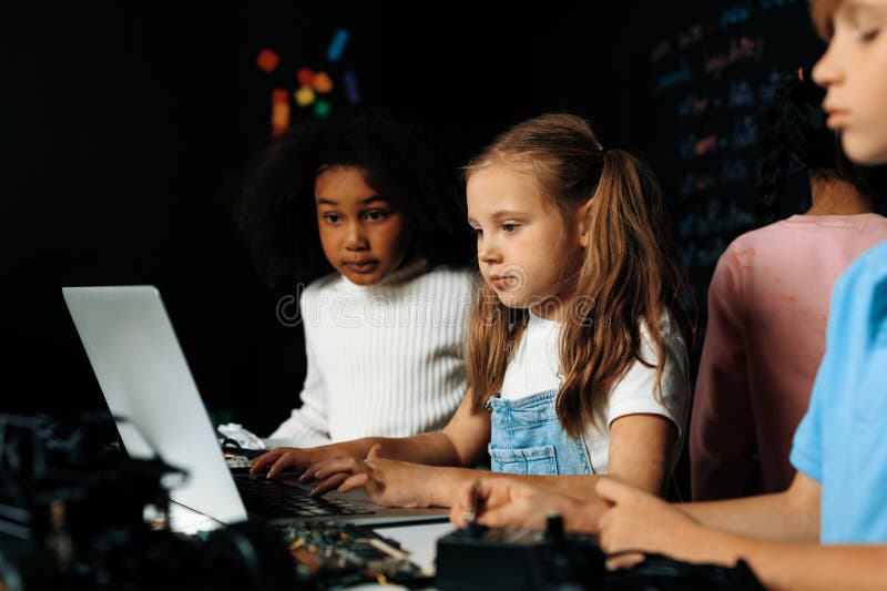 Smart Girl in White Bib Learning Robotics Technology Using Laptop ...