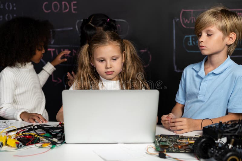 Smart Girl in White Bib Learning Robotics Technology Using Laptop. Erudition. Stock Image ...