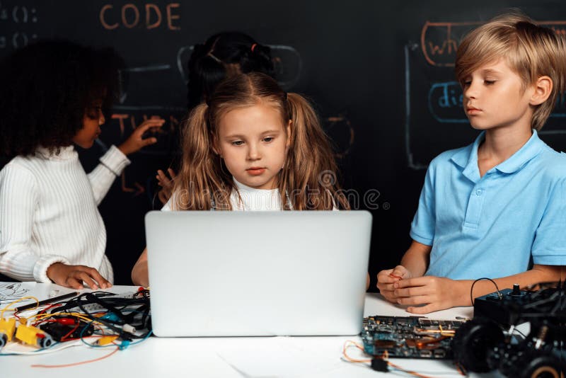 Smart Girl in White Bib Learning Robotics Technology Using Laptop ...