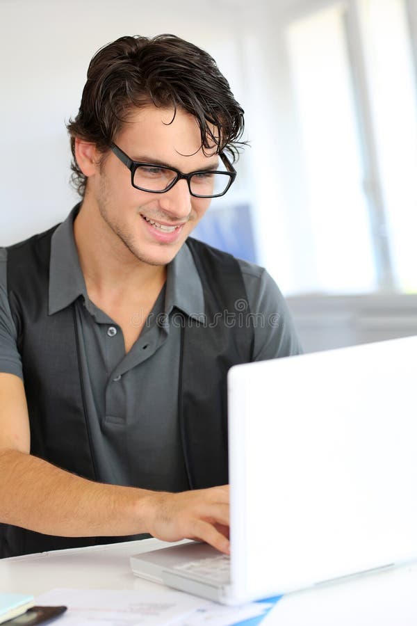 Smart guy in office stock photo. Image of eyeglasses - 26668272