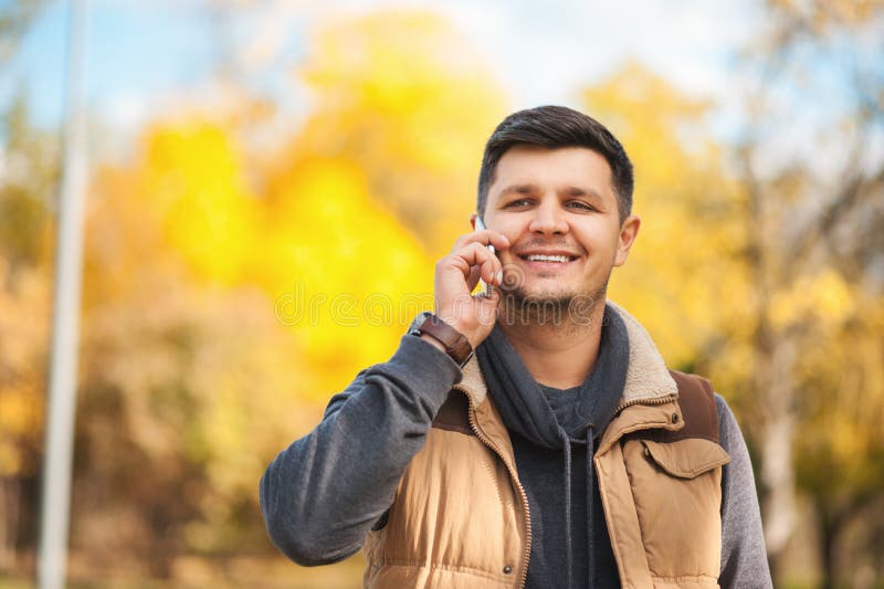 Smart Handsome Man Talking on Smartphone in Park Stock Photo - Image of ...