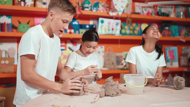 Smart Student Using Hand Press on Clay Piece at Pottery Workshop ...