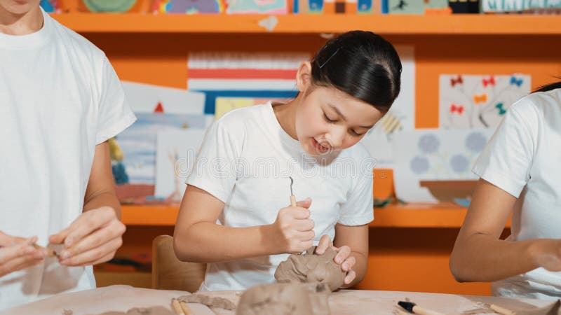 Smart Girl Using Carving Tool Working at Clay at Pottery Workshop ...
