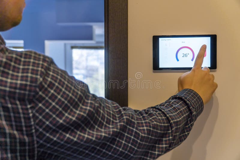 Smart Home Climate Control Device on a Wall Stock Photo - Image of ...
