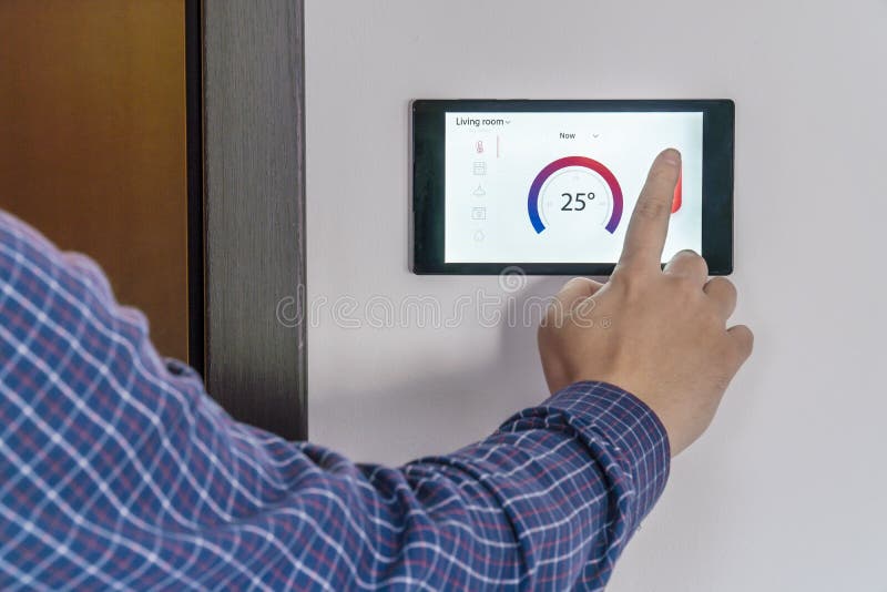 Smart Home Climate Control Device on a Wall Stock Photo - Image of ...