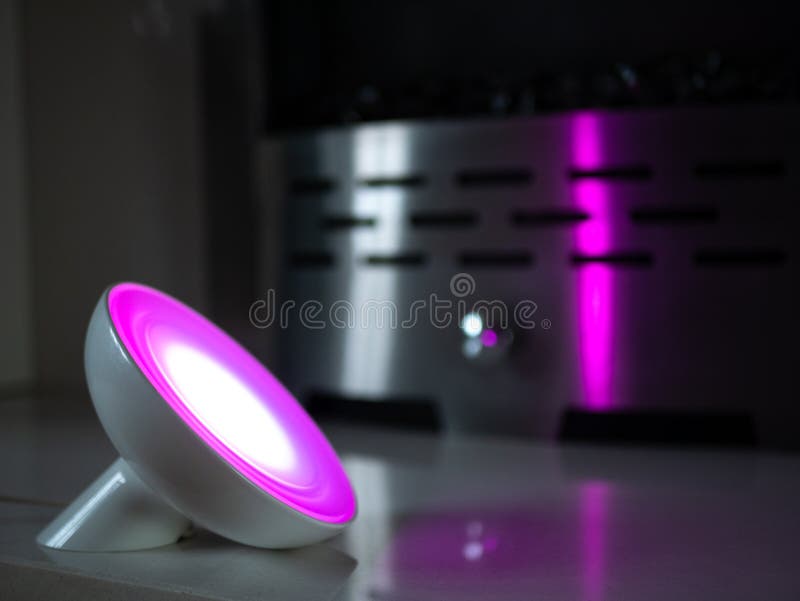 Smart Home Lamp Light with Coloured LED on Fireplace - Pink Stock Photo ...