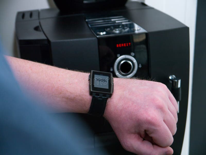 Smart Home: Man Checking Coffee Machine with His Smart Watch Stock ...
