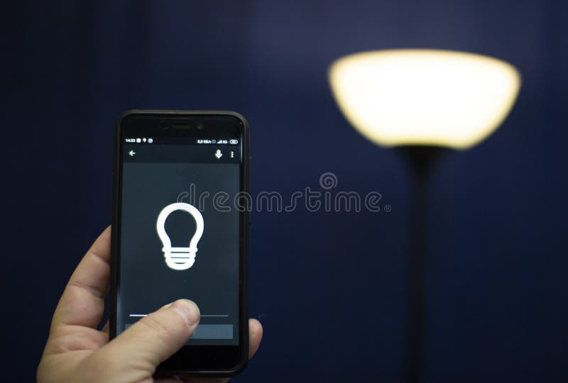 Smart Home: Man Controlling Lights with App on His Phone Stock Photo ...
