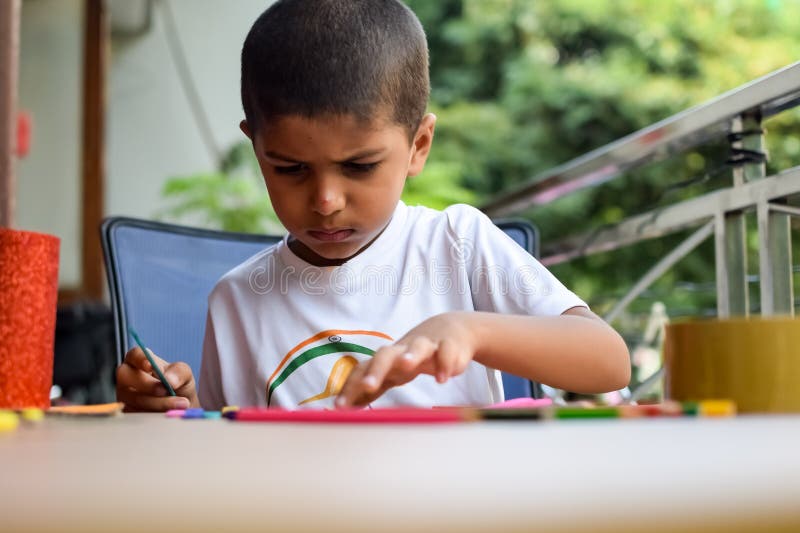 Smart Indian Little Boy Performing Best Out of Waste Activity with ...