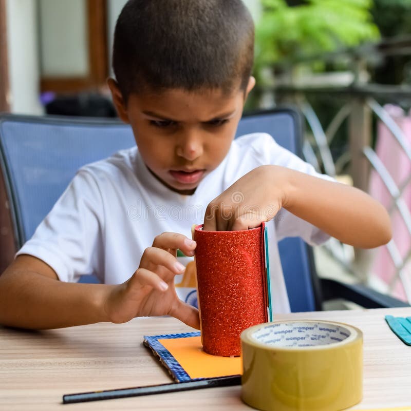 Smart Indian Little Boy Performing Best Out of Waste Activity with ...