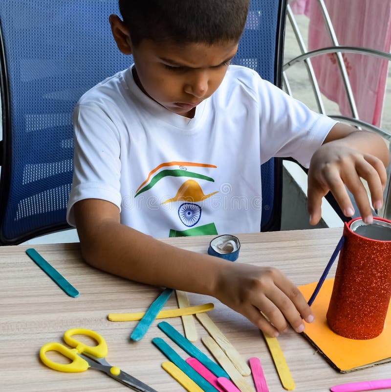 Smart Indian Little Boy Performing Best Out of Waste Activity with ...
