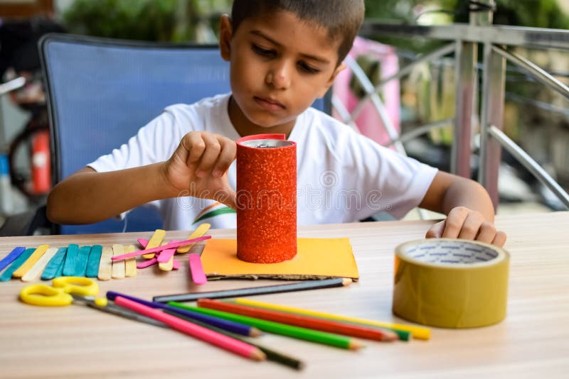 Smart Indian Little Boy Performing Best Out of Waste Activity with ...