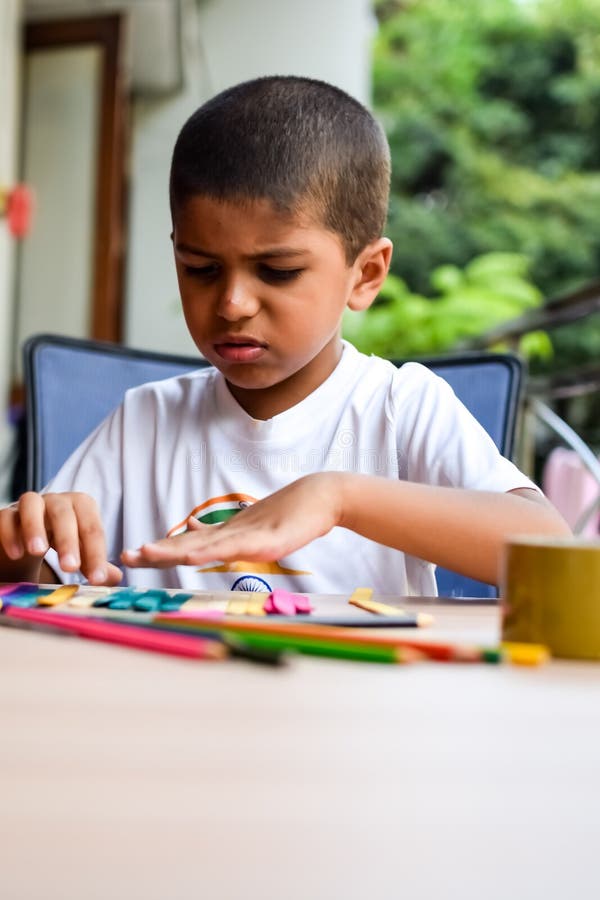 Smart Indian Little Boy Performing Best Out of Waste Activity with ...