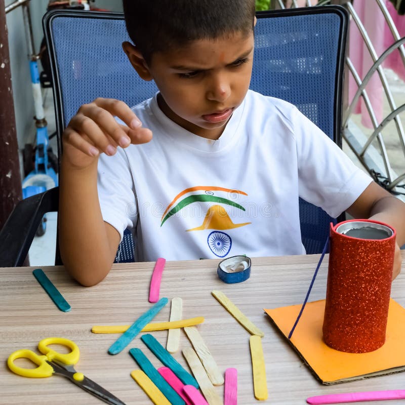 Smart Indian Little Boy Performing Best Out of Waste Activity with ...