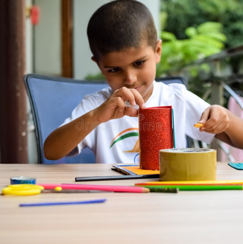 Smart Indian Little Boy Performing Best Out of Waste Activity with ...