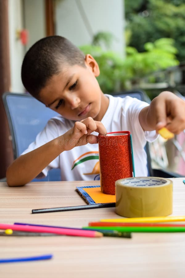 Smart Indian Little Boy Performing Best Out of Waste Activity with ...