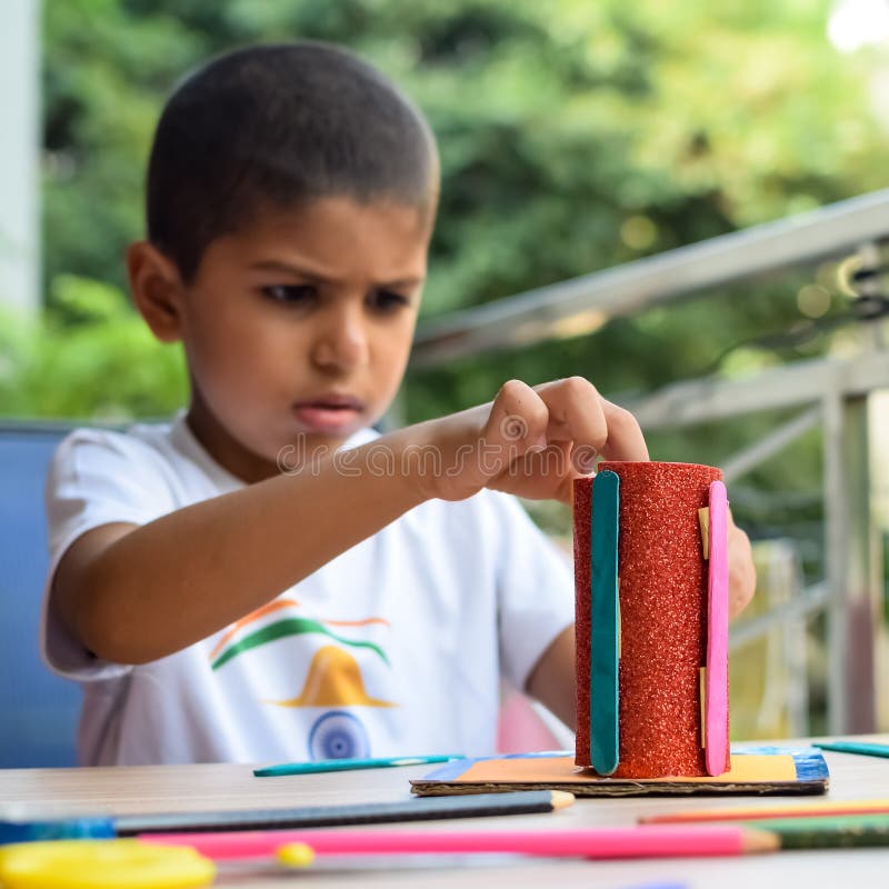 Smart Indian Little Boy Performing Best Out of Waste Activity with ...