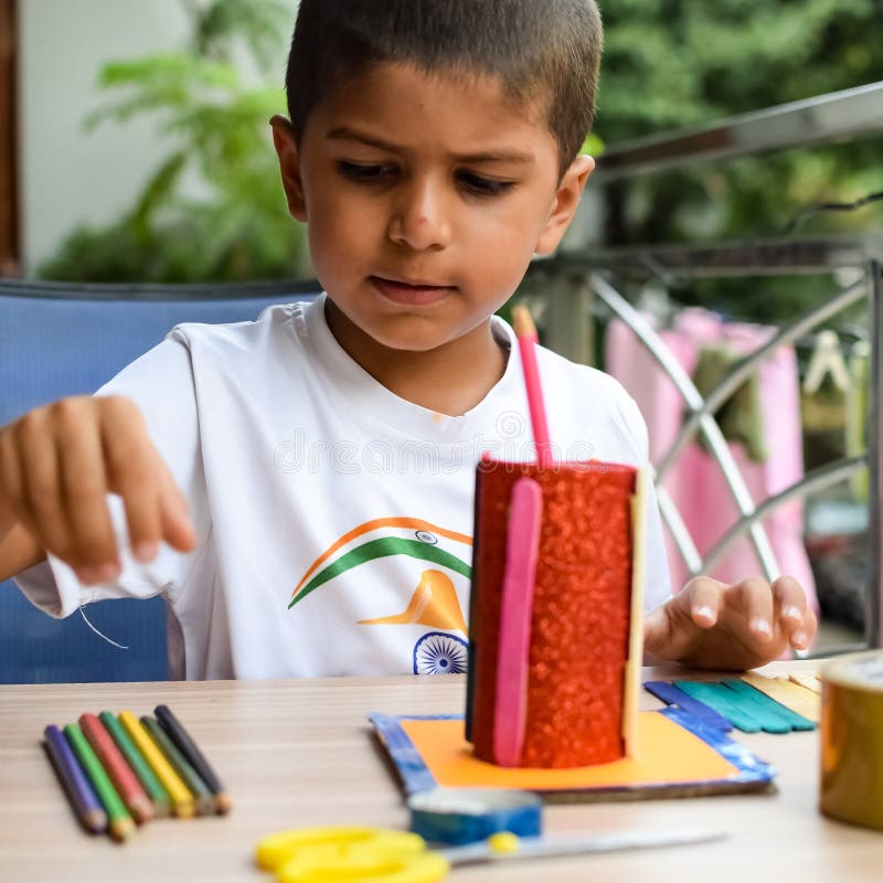 Smart Indian Little Boy Performing Best Out of Waste Activity with ...