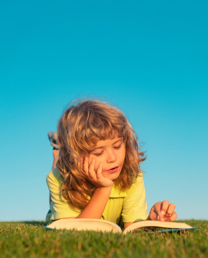 Smart Kid Boy Reading Book in Park Outdoor. Stock Image - Image of ...