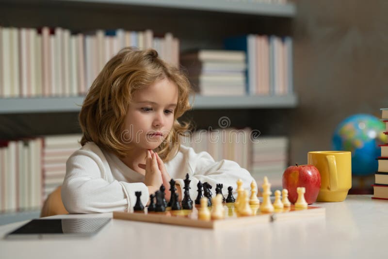 Kid Playing Chess in the Room. Child Playing Chess. Clever Kid Thinking about Chess. Stock Image ...