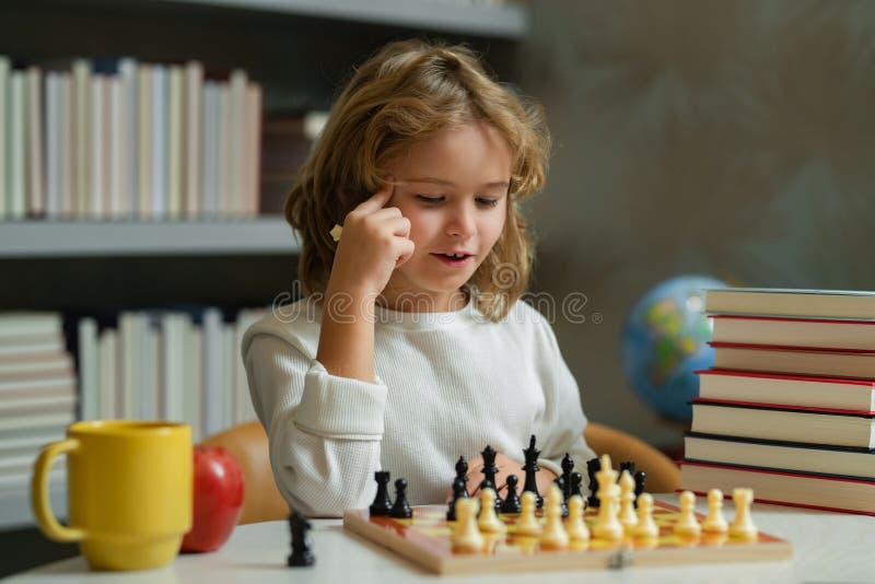 Smart Kid Playing Chess. Clever Child Thinking about Chess. Games Good ...