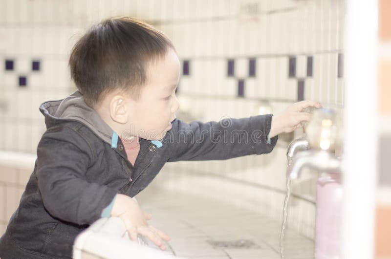 Smart Kid Washing Hands with Faucet Stock Photo - Image of refreshment ...