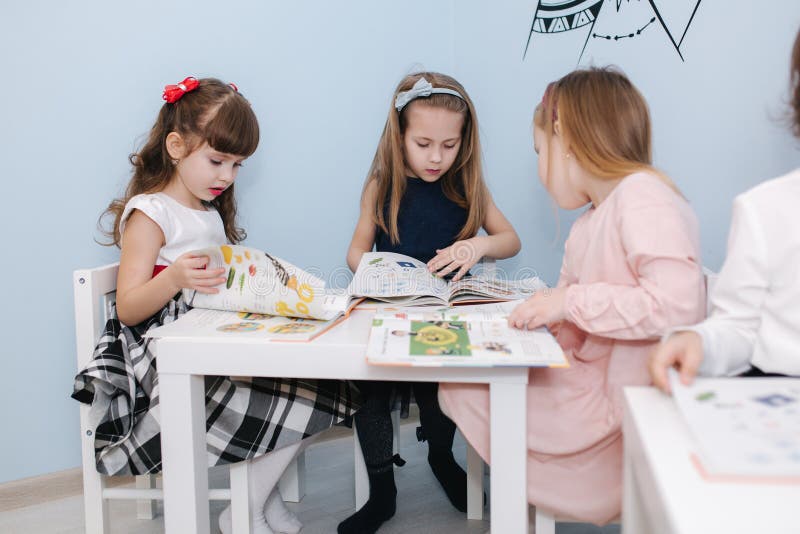 Smart Kids Learning in Prescool Class. Female Chlidren Play in ...