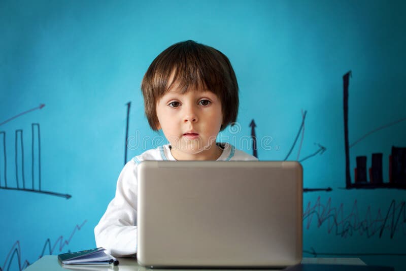 Smart Little Boy, Working on Computer and Taking Notes Stock Photo ...