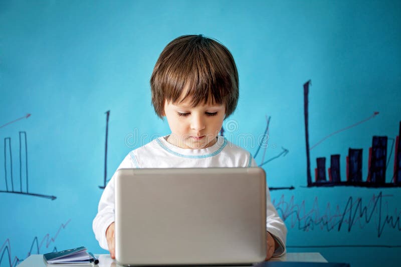 Smart Little Boy, Working on Computer and Taking Notes Stock Image ...
